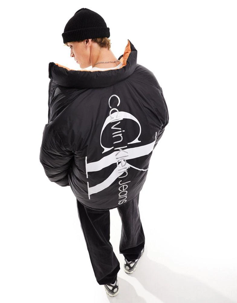 Calvin Klein Jeans Calvin Klein Jeans reversible 90s puffer jacket in orange - Coats - Free ...