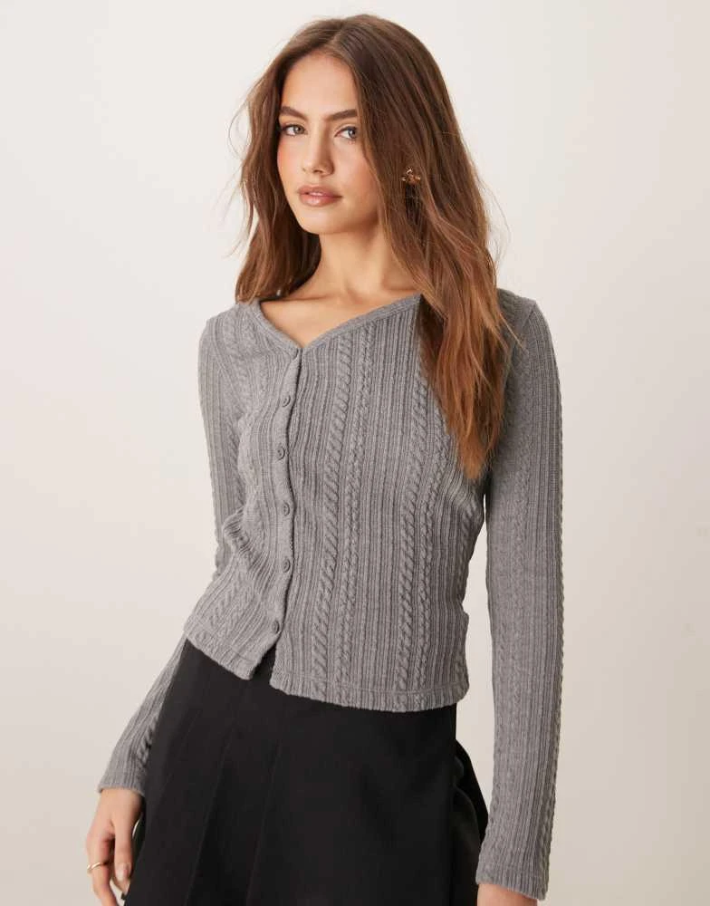 Shop ASOS DESIGN asymmetric cable button through in grey on Sale at ...